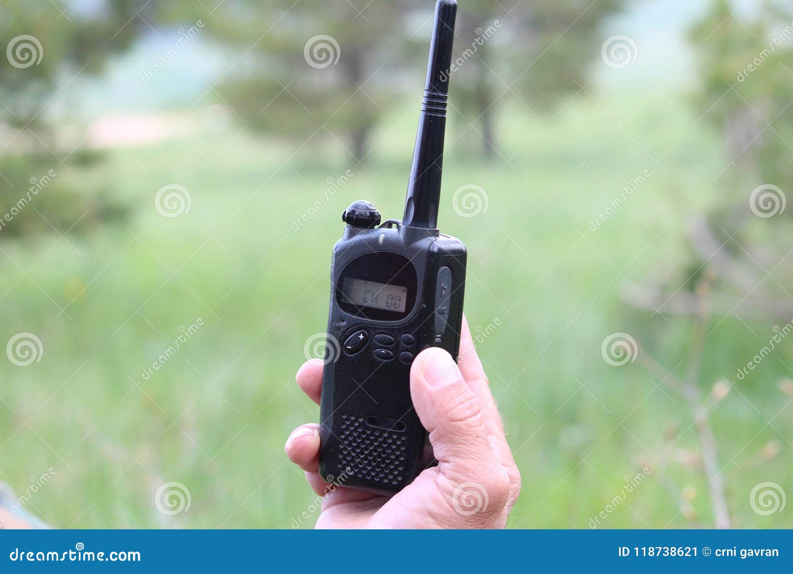 The Operator at the Workplace Allocates Workers with a Walkie-talkie ...