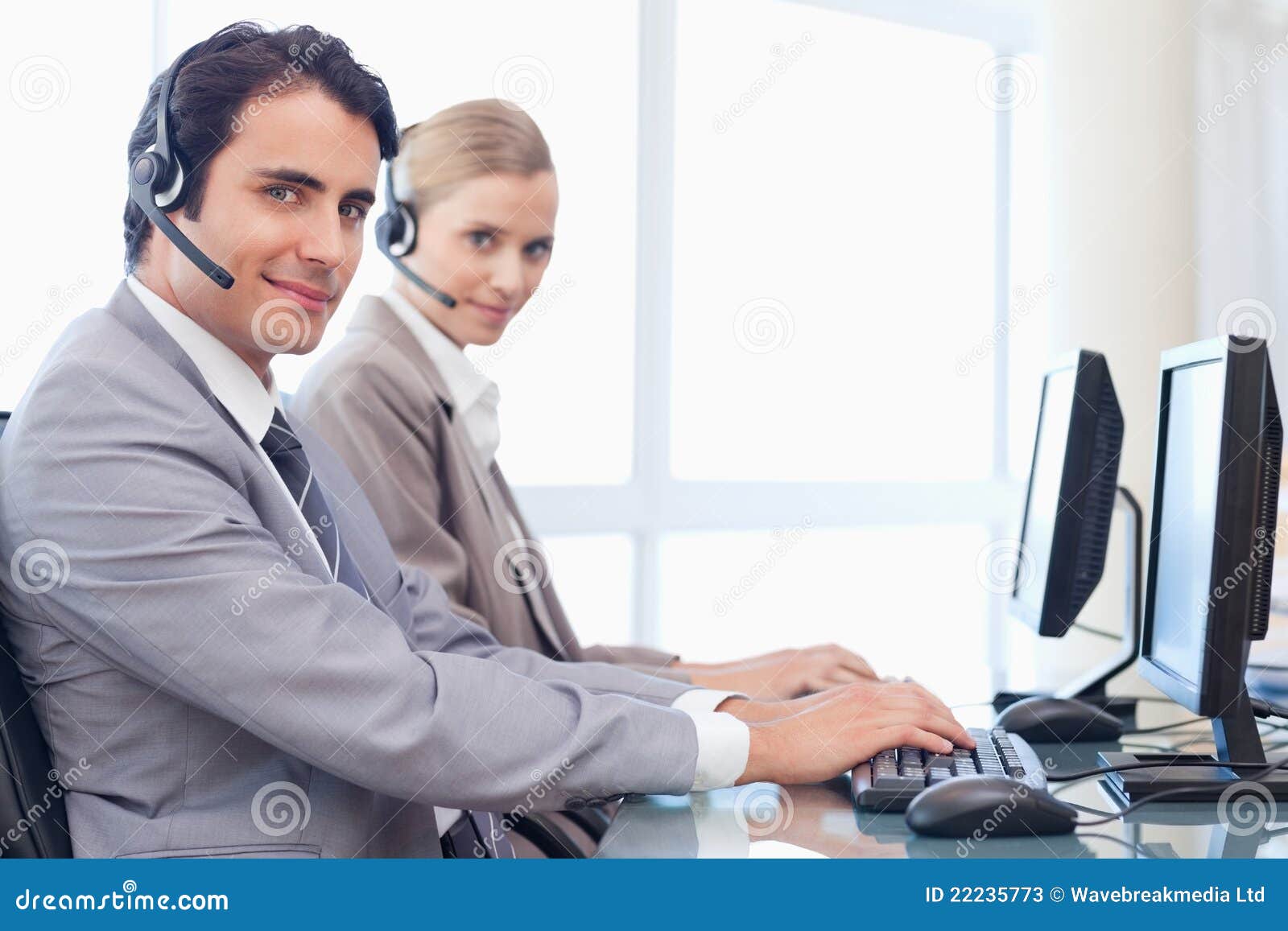 Operators using a monitor stock image. Image of call - 22235773