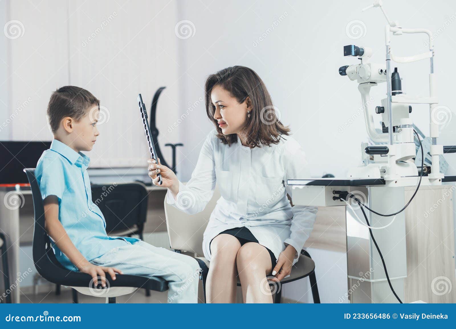 Ophthalmologist Checks the Boy`s Vision. Vision Tests in Children ...