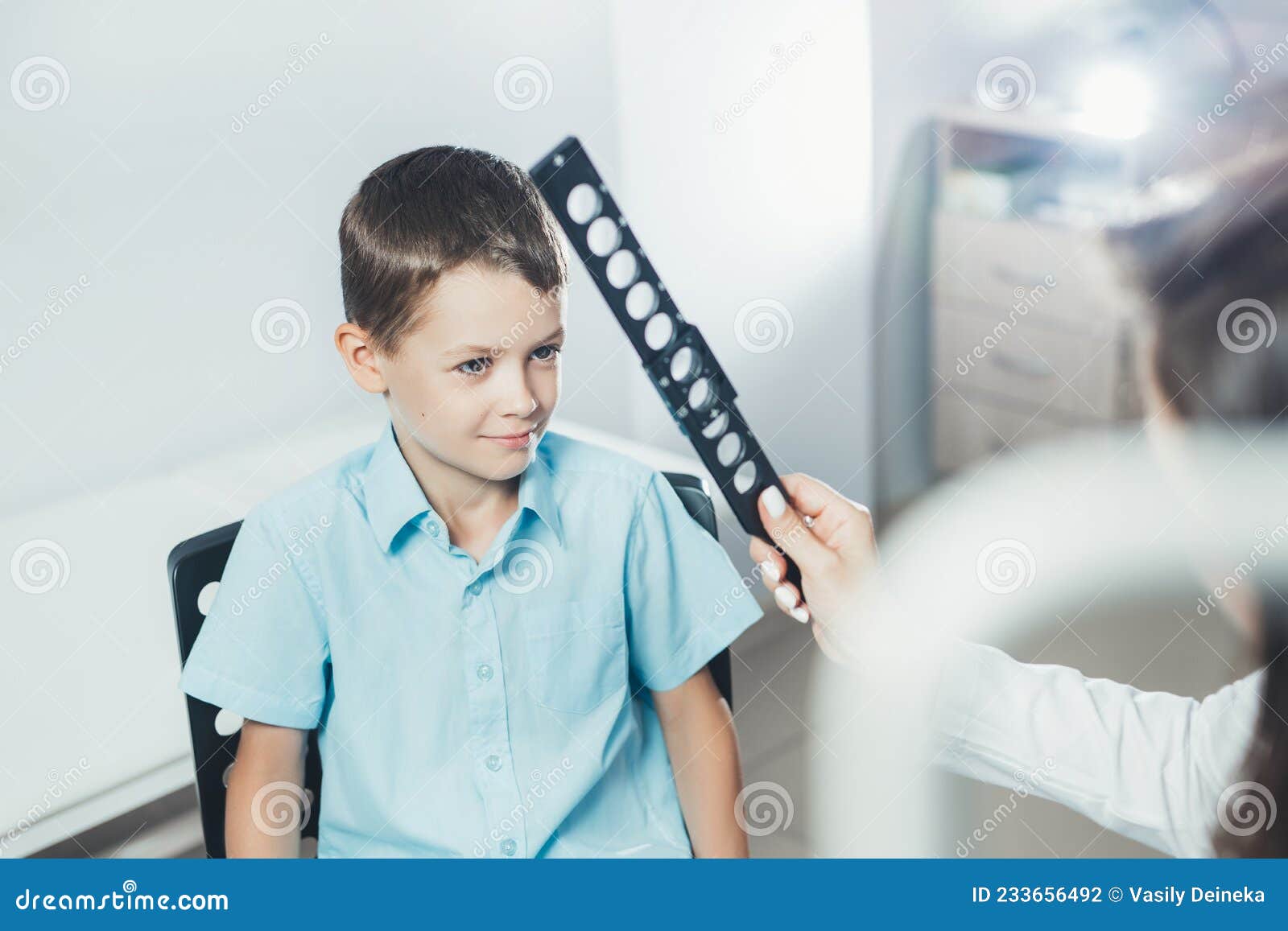 Ophthalmologist Checks the Boy`s Vision. Hyperopia. Vision Tests in ...