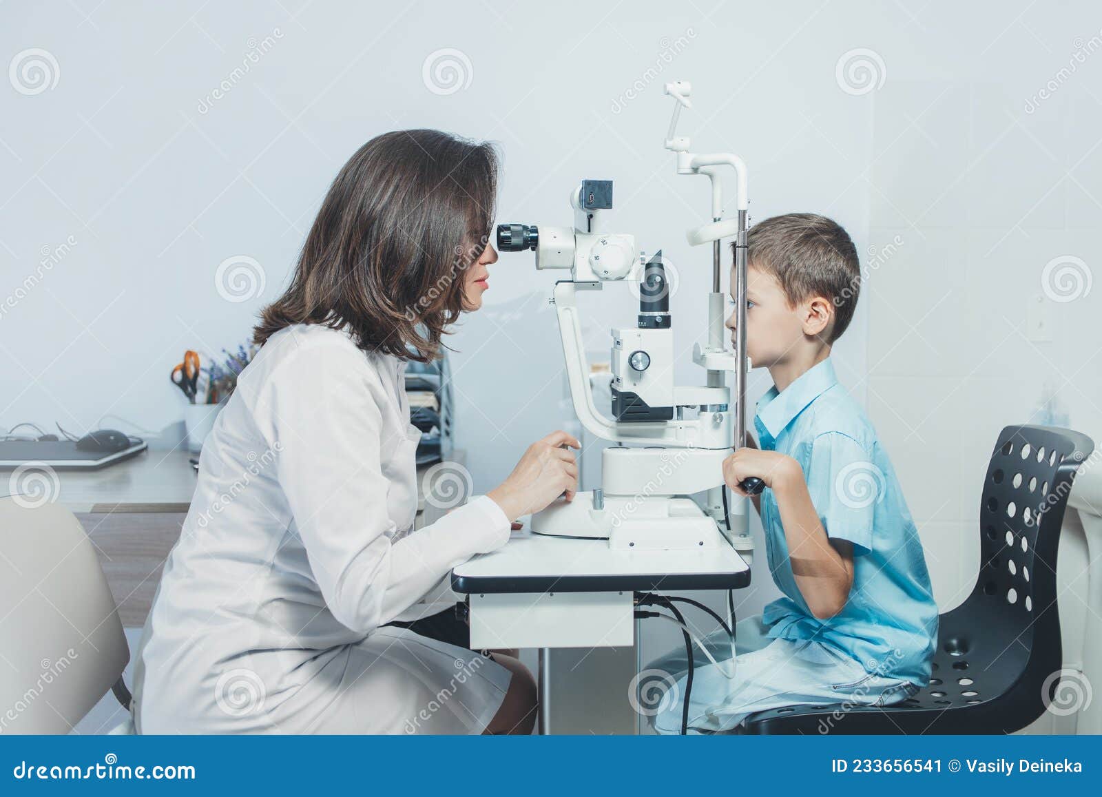 Ophthalmologist Checks the Boy`s Vision. Vision Tests in Children ...
