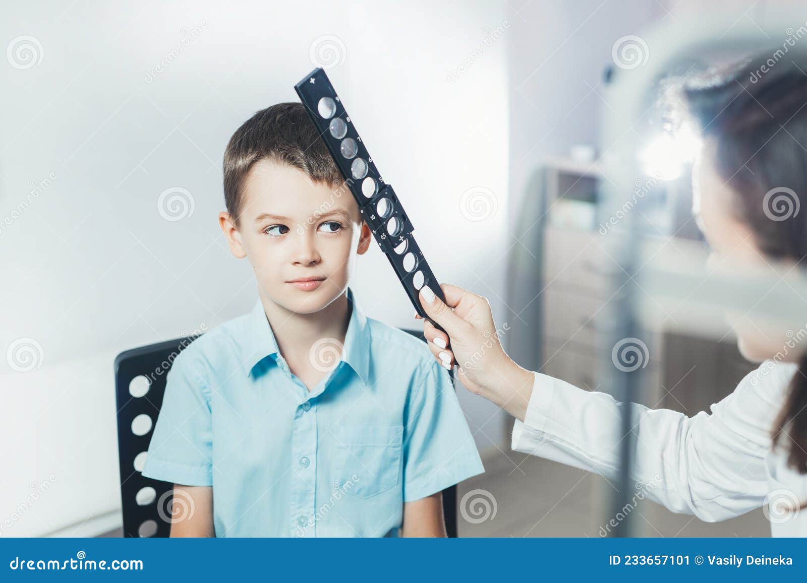 Ophthalmologist Checks the Boy`s Vision. Hyperopia. Vision Tests in ...