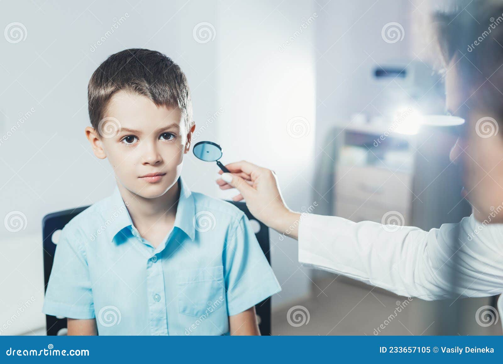 Ophthalmologist Checks the Boy`s Vision. Hyperopia. Vision Tests in ...