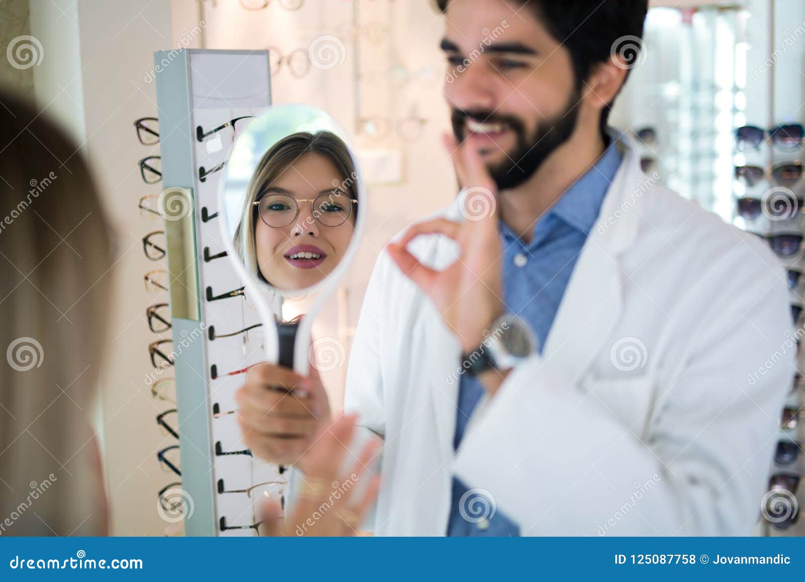 Ophthalmologist Doing a Visual Examination for a Customer Stock Photo ...