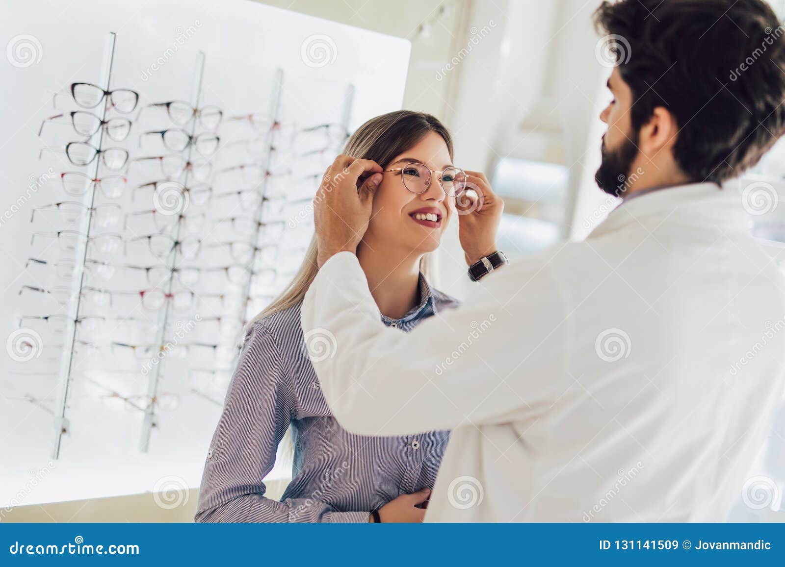 Ophthalmologist Doing a Visual Examination for a Customer Stock Image ...
