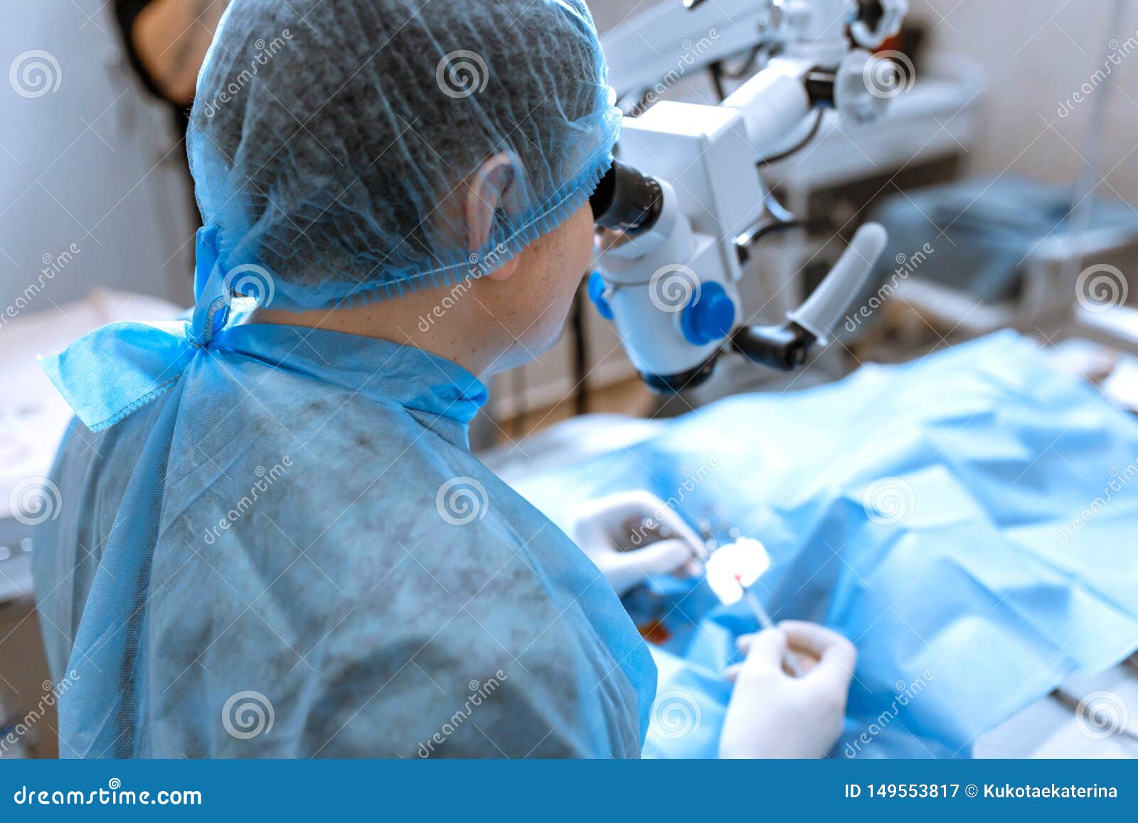 Ophthalmologist Or Surgeon Holds In Hand Dressed In A Blue Glove Eye ...