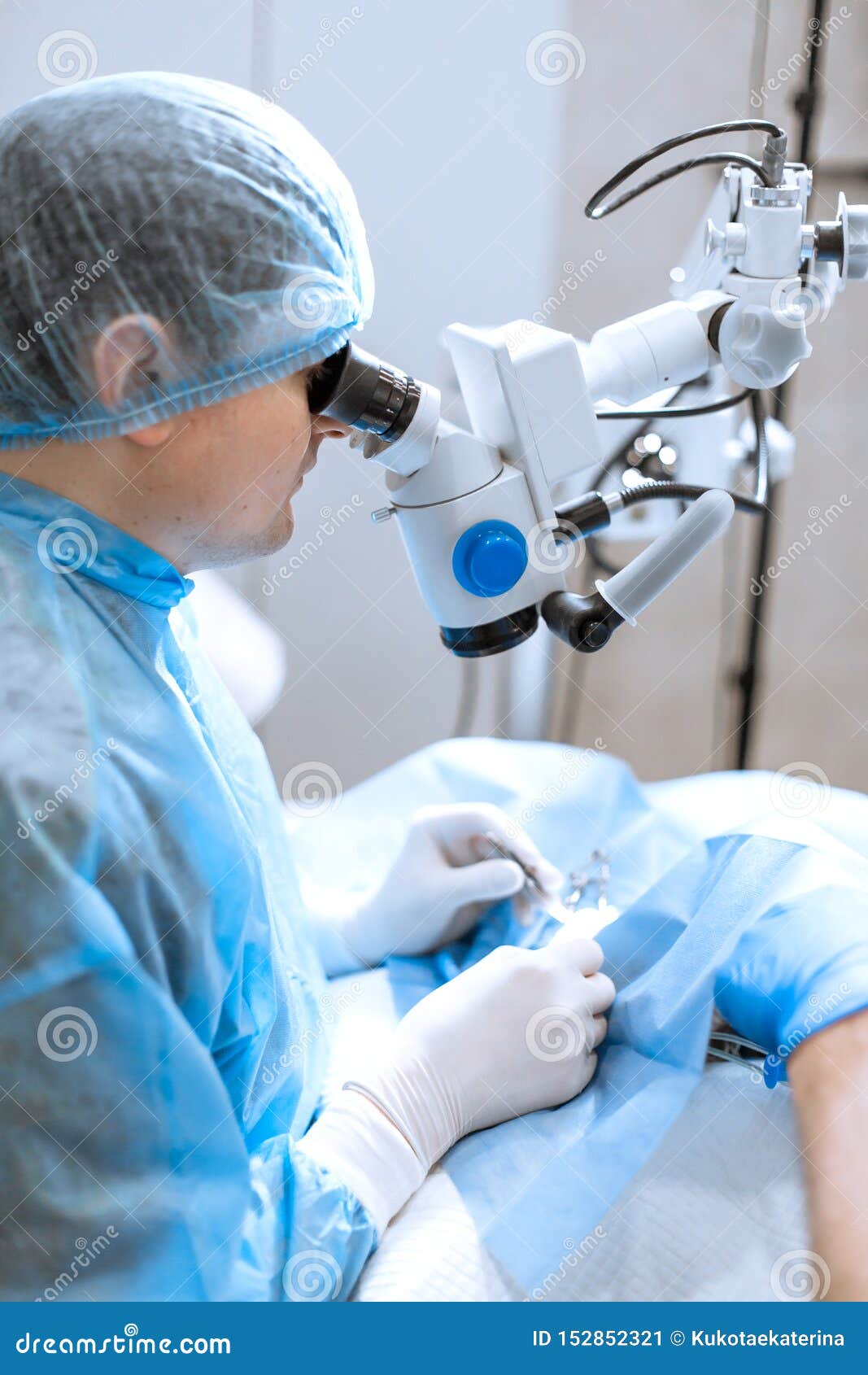 Ophthalmologist Surgeon Looking through Surgical Microscope Doing ...