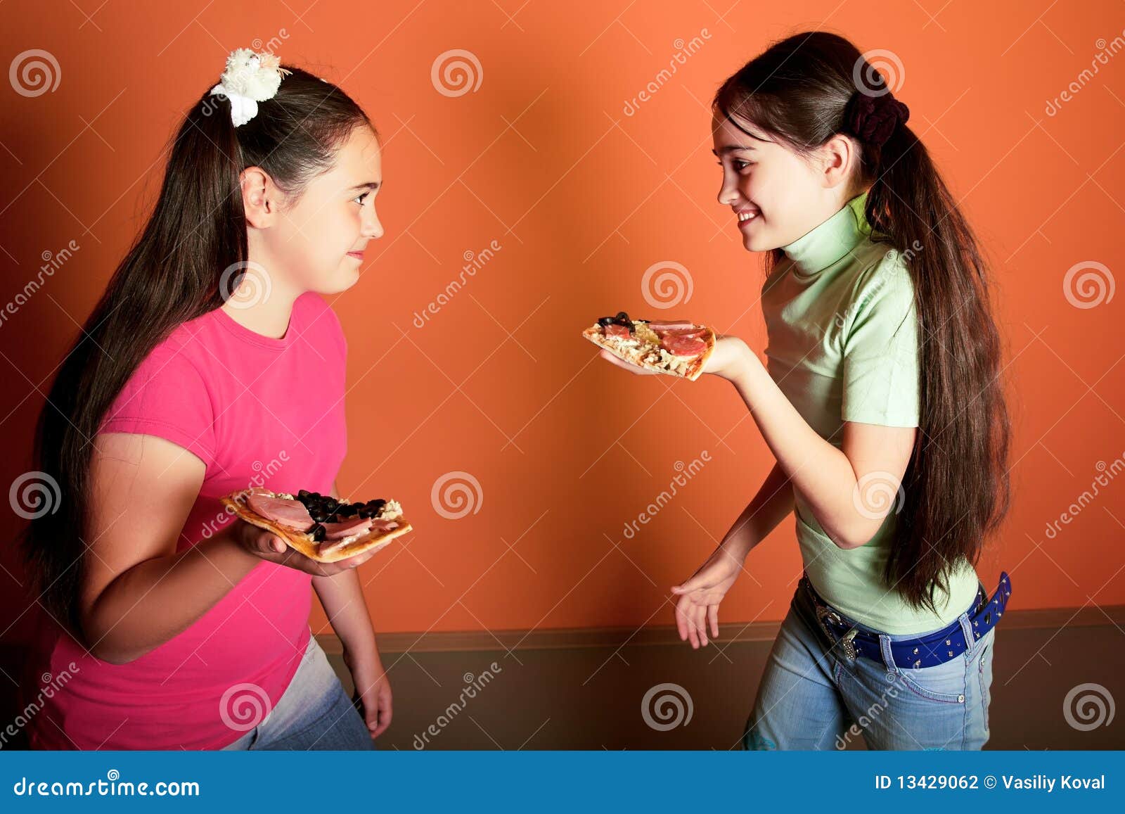Opposite Young Girl with Pizza Stock Photo - Image of dark, meat: 13429062