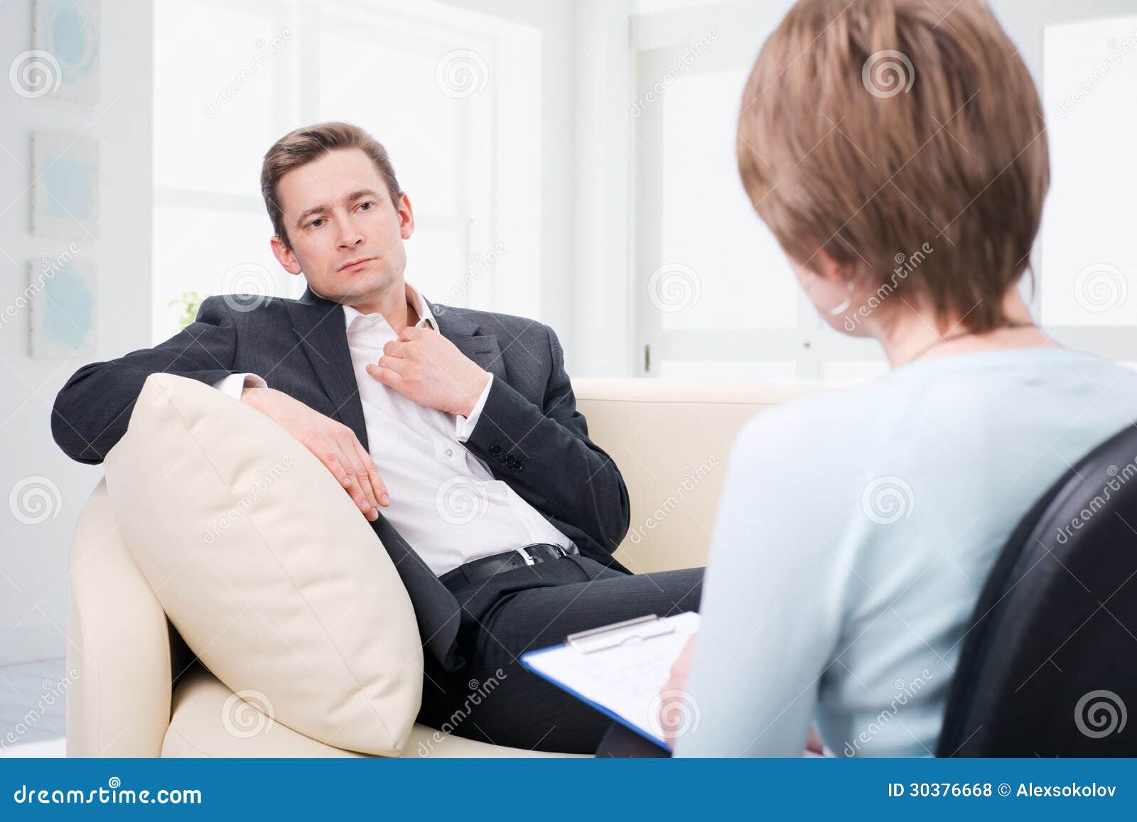 Oppressed Man Talking with Psychologist Stock Photo - Image of ...