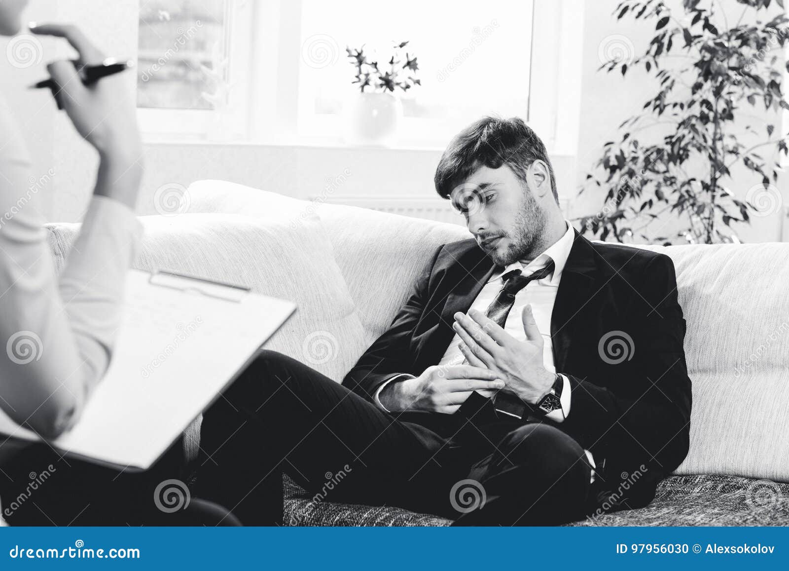 Oppressed Man Talking with Psychologist Stock Photo - Image of ...
