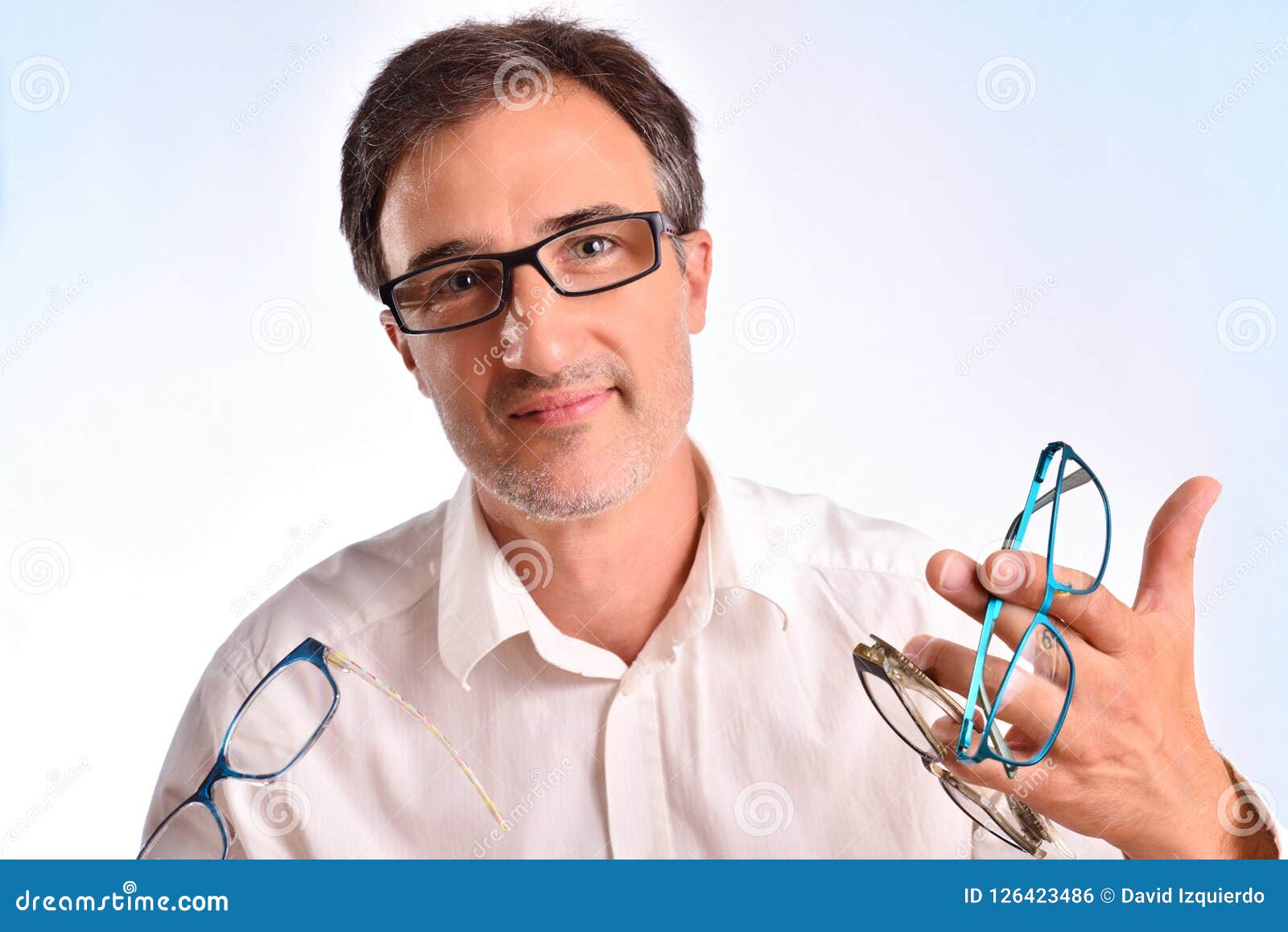 Optical Business Man Showing Several Eyeglasses Stock Photo - Image of ...