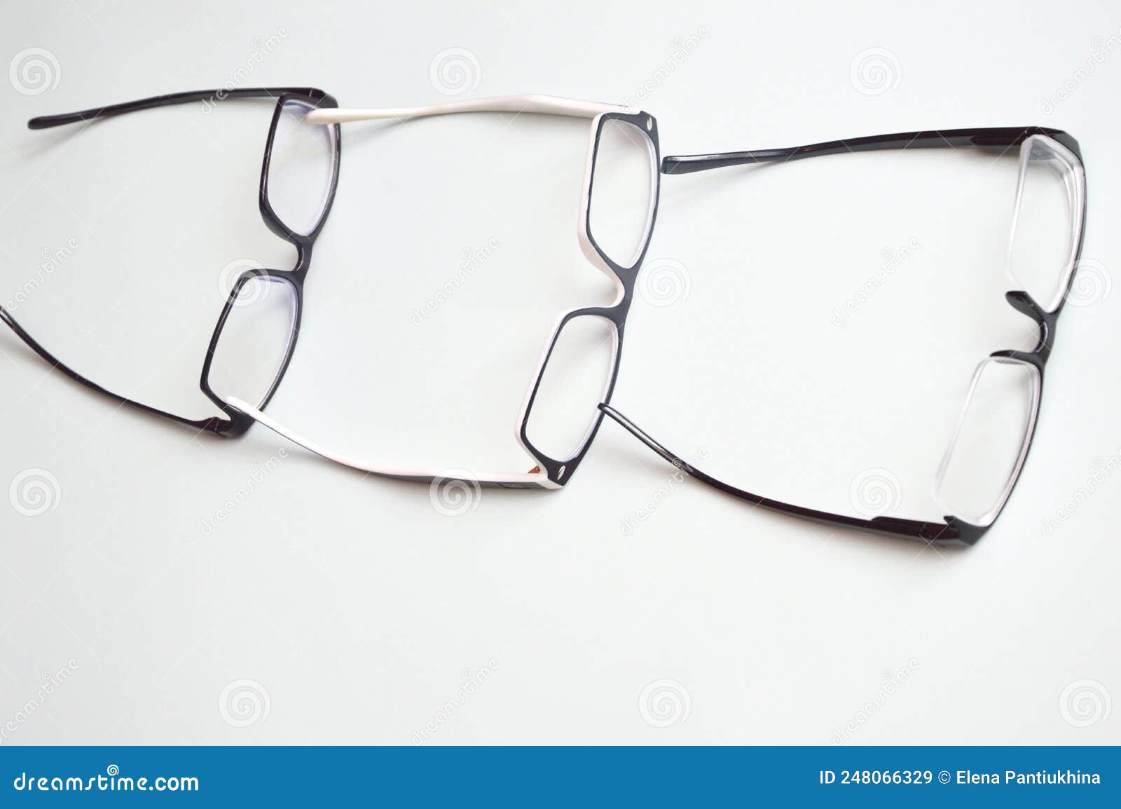 Optical Glasses, in a Black Frame, Lying in a Row on a White Background ...