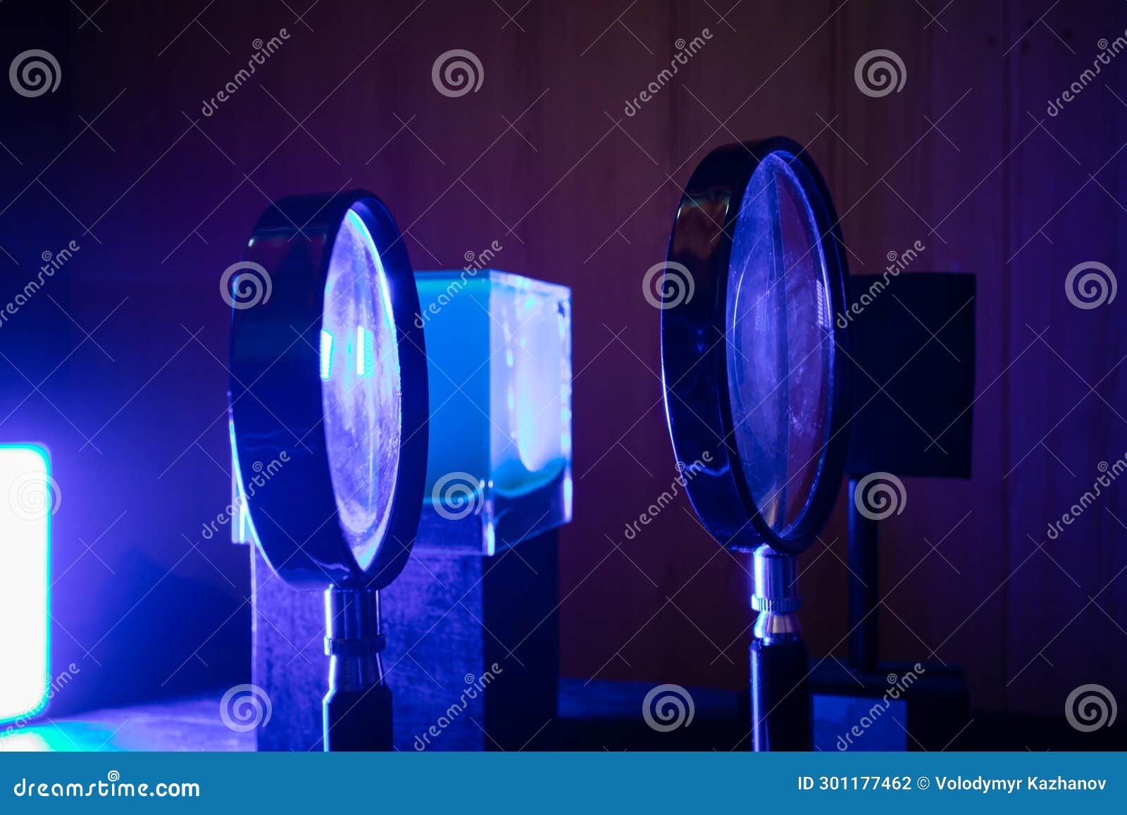 Optical Lenses on Stands in Blue Light in Laboratory Stock Photo ...