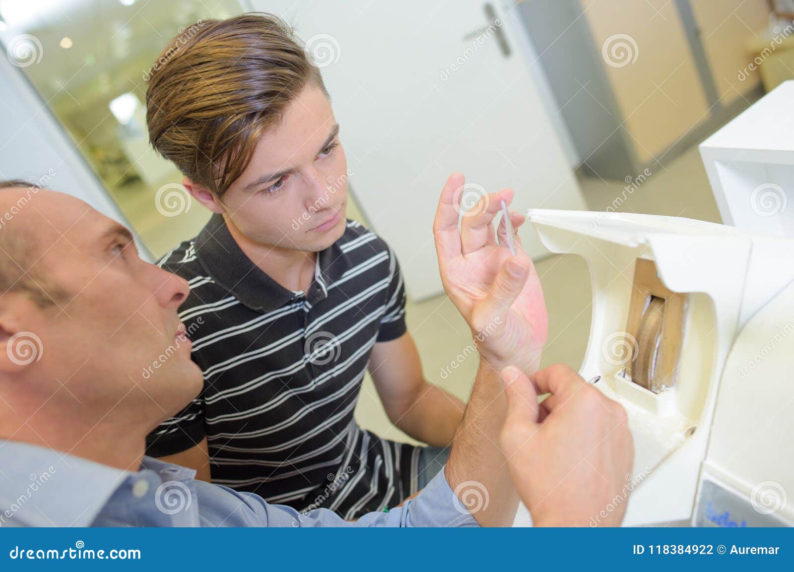 Optician and Apprentice Looking at Lens Stock Photo - Image of health ...