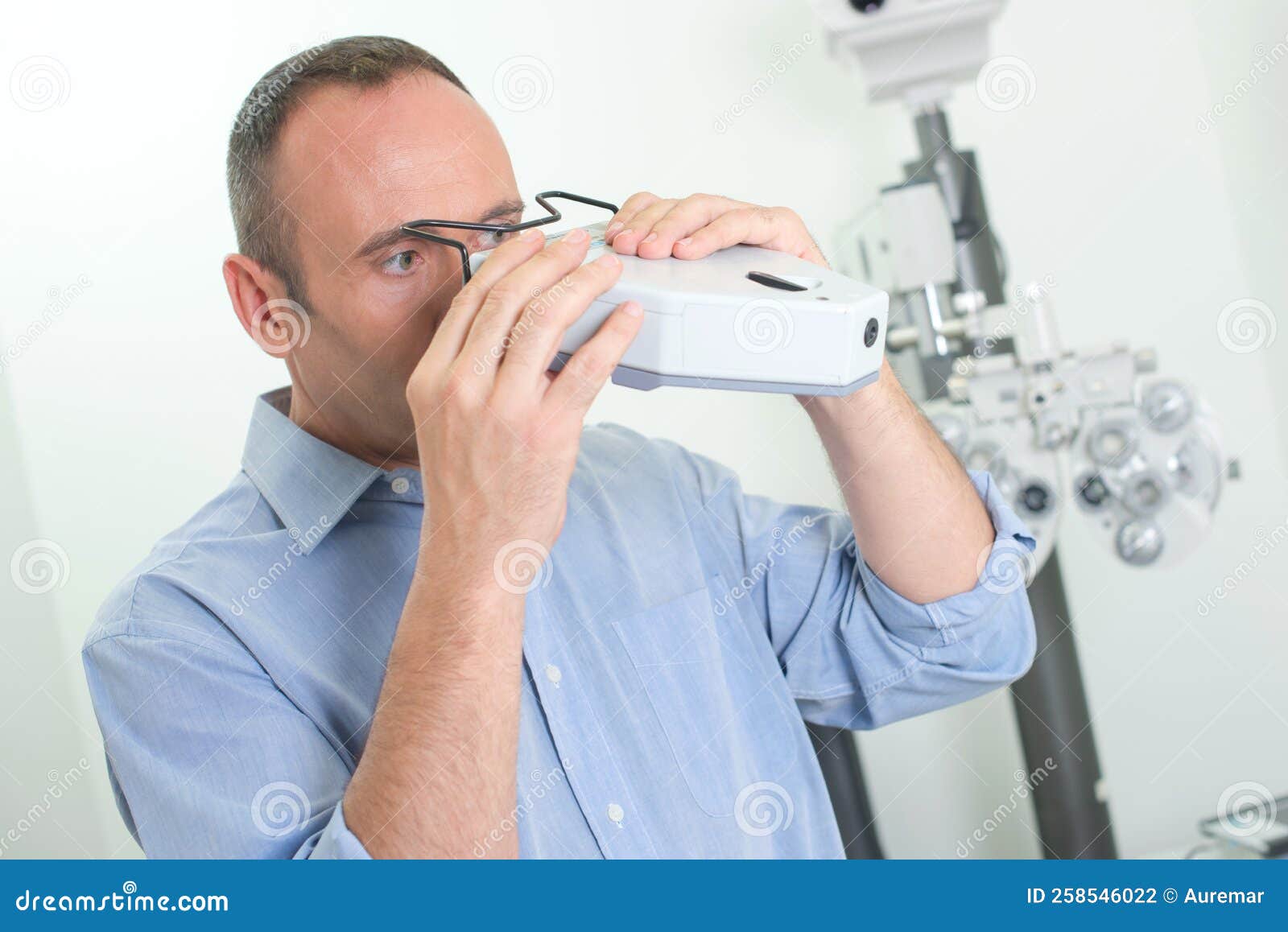 Optician Checking Vision Machine Stock Photo - Image of sight, examine ...
