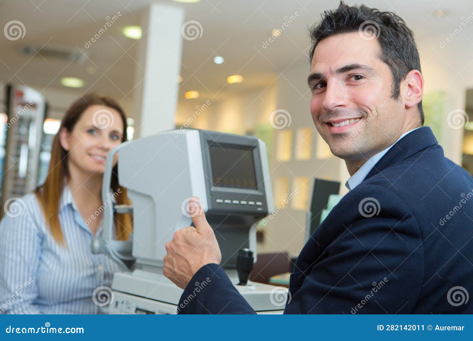 Optician Doing Scan Test To Patients Eyes Stock Image - Image of ...