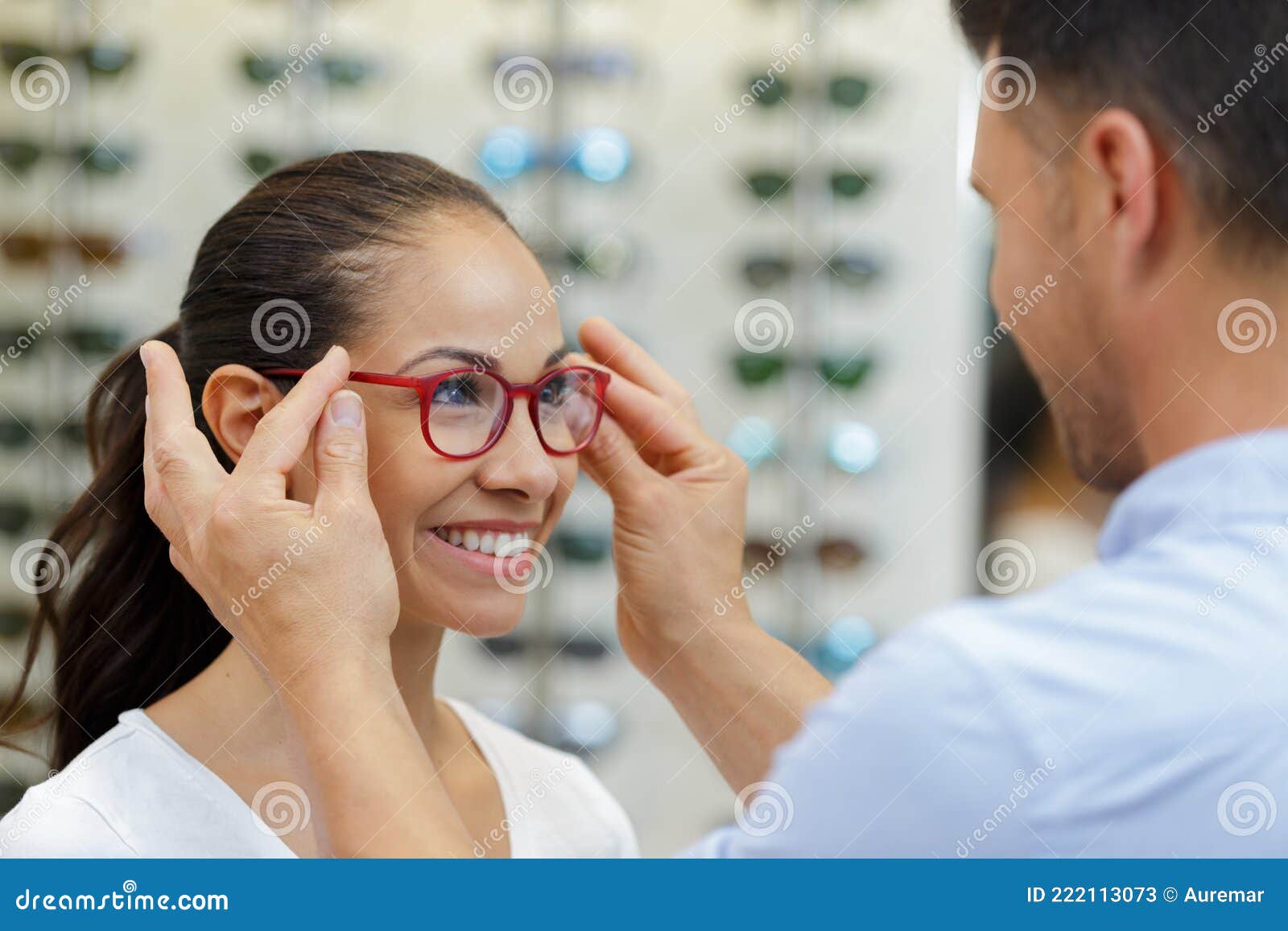 Optician. Beautiful Brunette Wearing Glasses And Snellen Eye Exam Chart ...