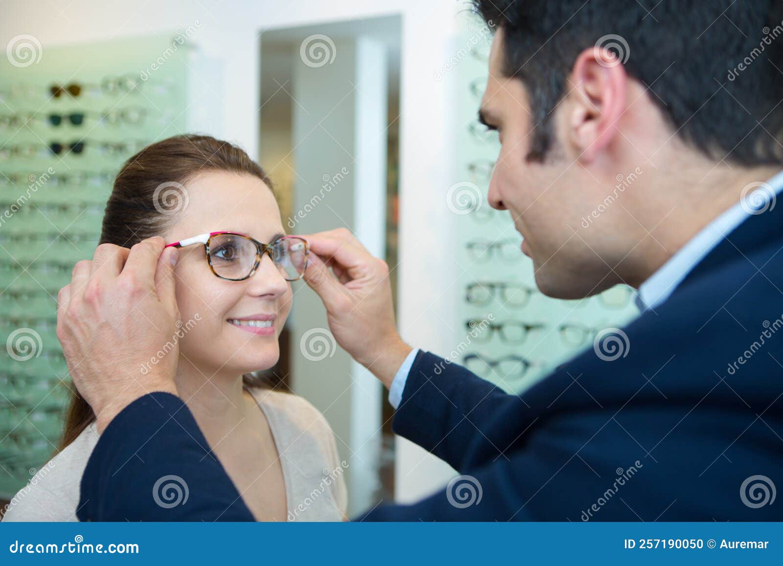 Optician Fitting New Glasses for Female Patient Stock Photo - Image of ...