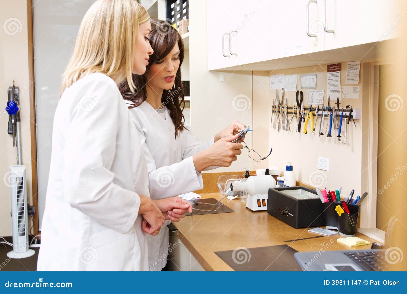 Optician Giving Instructions To New Employee Stock Image - Image of ...