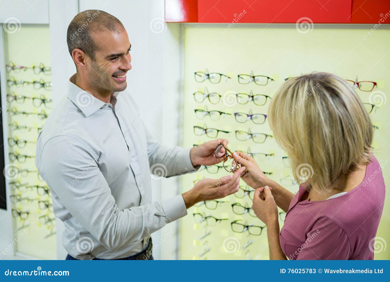 Optician Helping Customer for Selecting a Spectacles Frame Stock Image ...