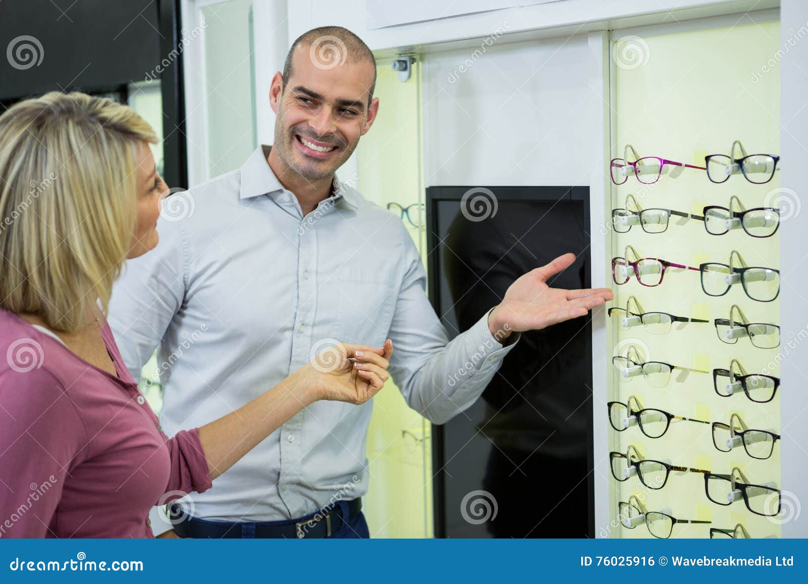 Optician Helping Customer for Selecting a Spectacles Frame Stock Photo ...