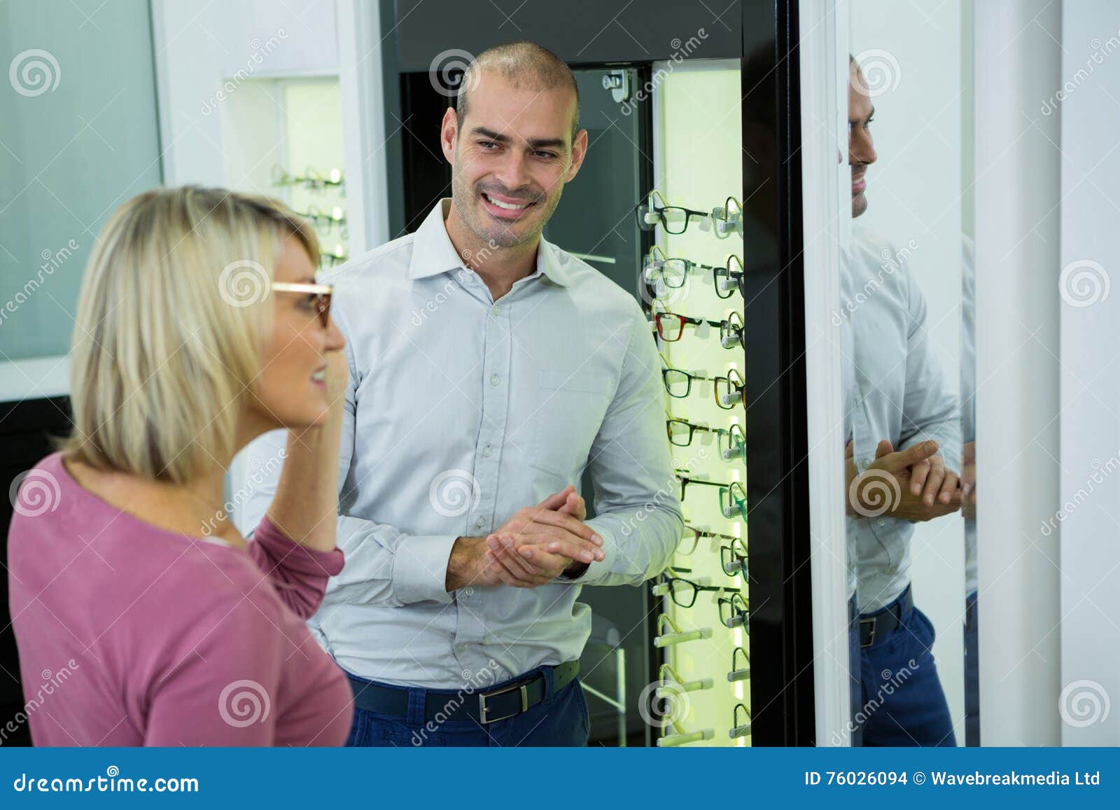 Optician Helping Customer for Selecting a Spectacles Frame Stock Photo ...