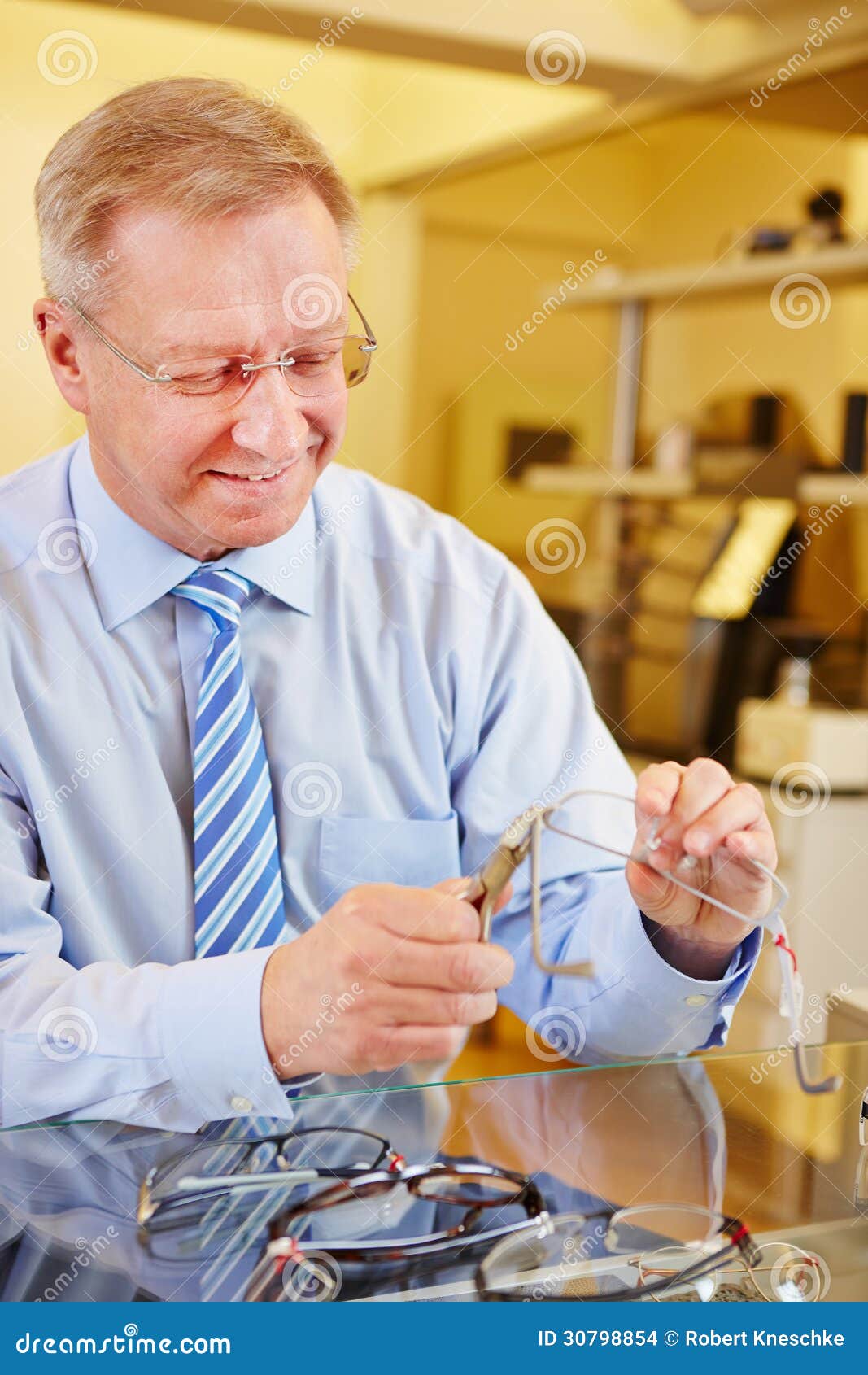 Optician repairing glasses stock photo. Image of profession - 30798854