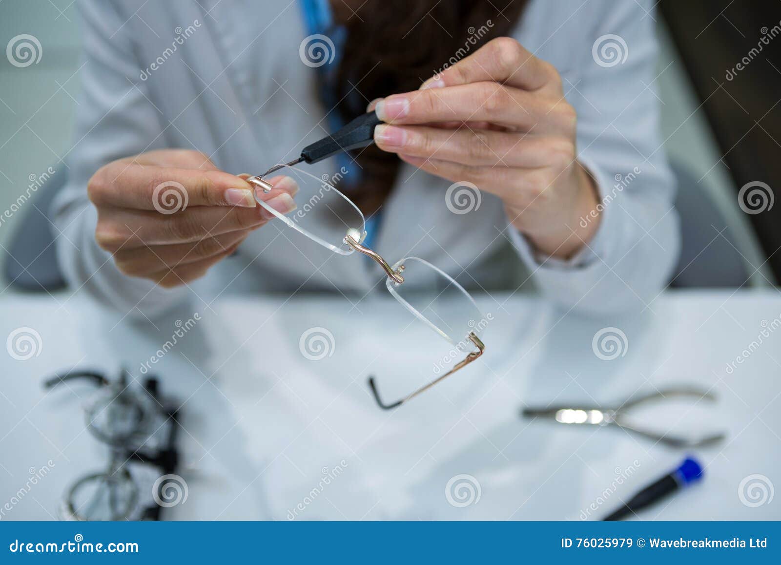 Optician Repairing Spectacles with Tool Stock Image - Image of ...