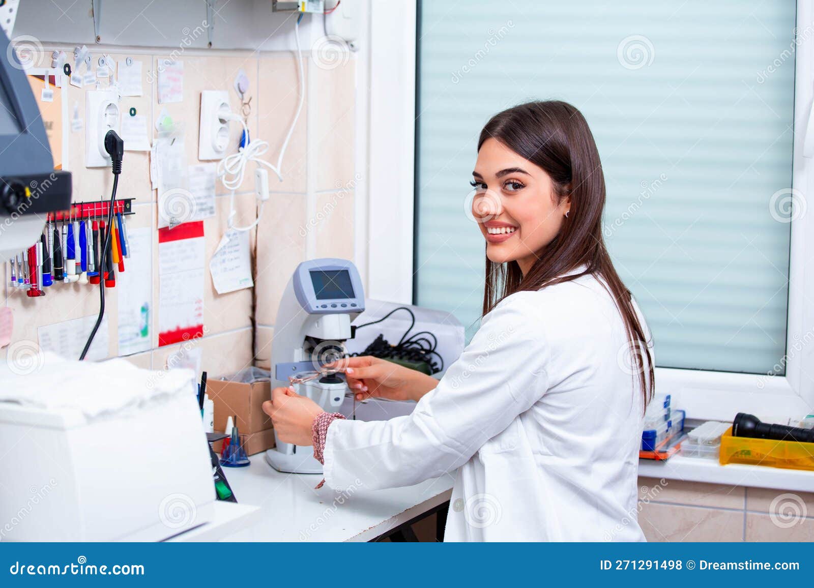 Optician Repairing Spectacles with Tool in Optical Store Stock Photo ...