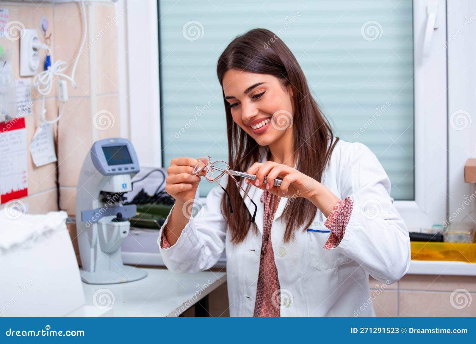 Optician Repairing Spectacles with Tool in Optical Store Stock Image ...