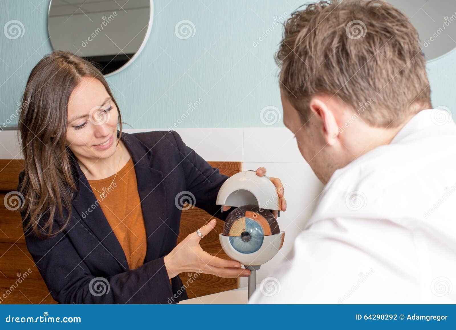 Optician Showing an Eye To a Client Stock Photo - Image of provider ...