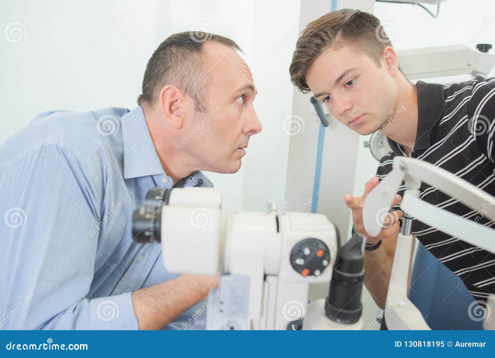 Optician Showing Machinery To Apprentice Stock Image - Image of medical ...