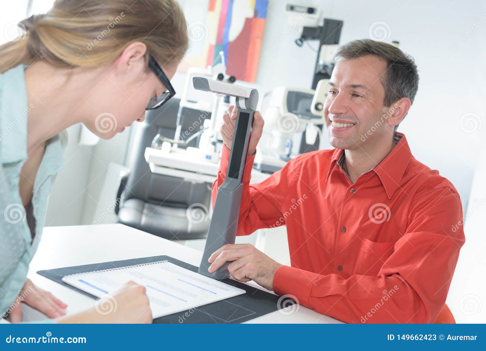 Optician Showing Text for Patient To Read Stock Image - Image of ...