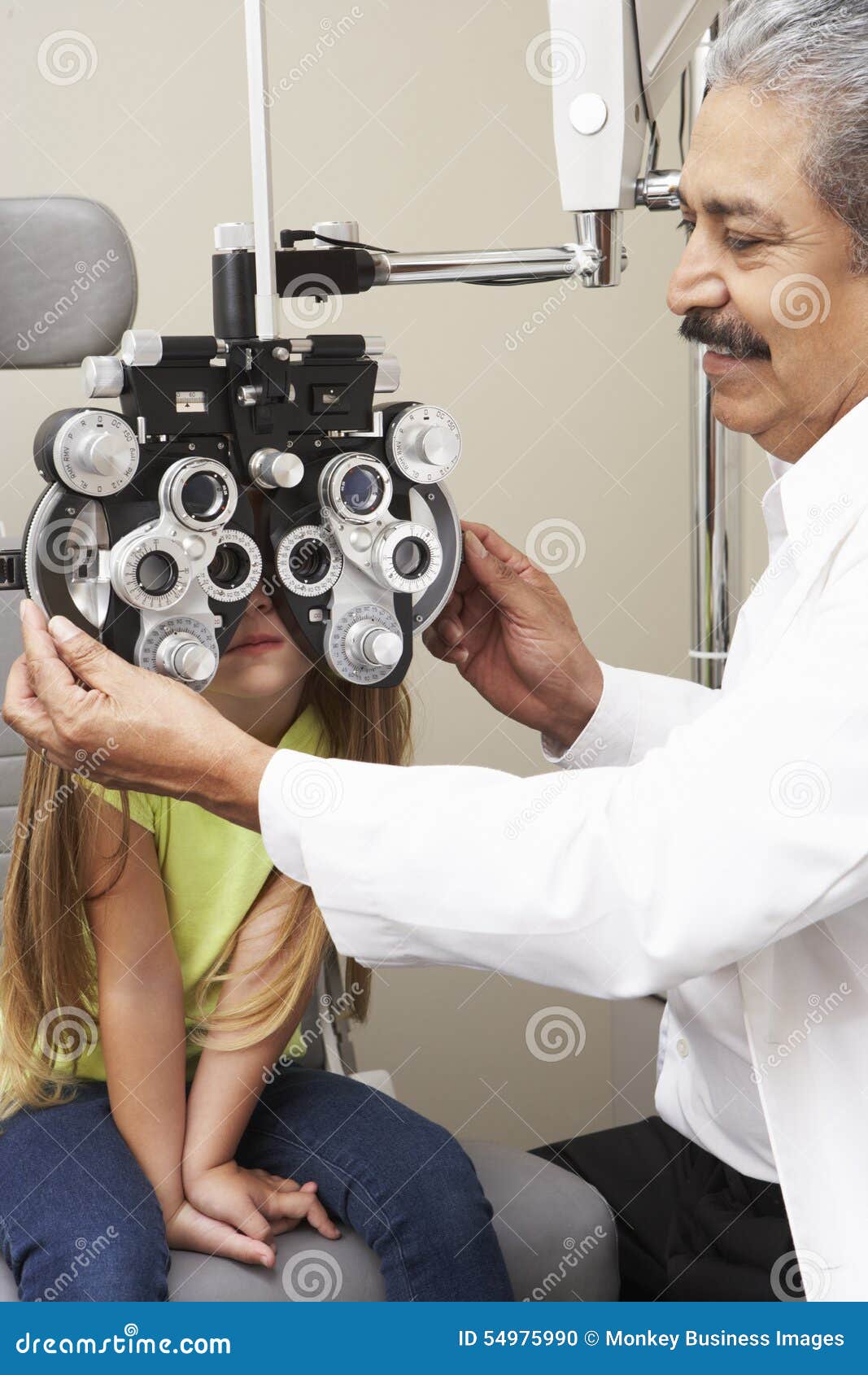 Optician in Surgery Giving Girl Eye Test Stock Photo - Image of exam ...