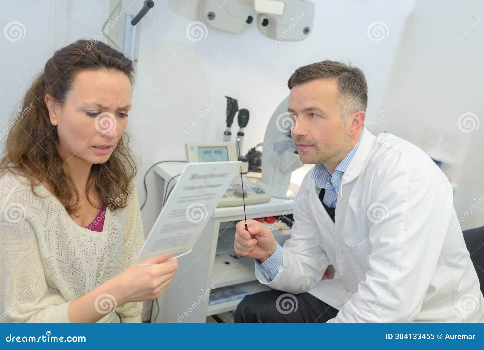 Optician and Woman Reading during Eye Sight Test Stock Image - Image of ...