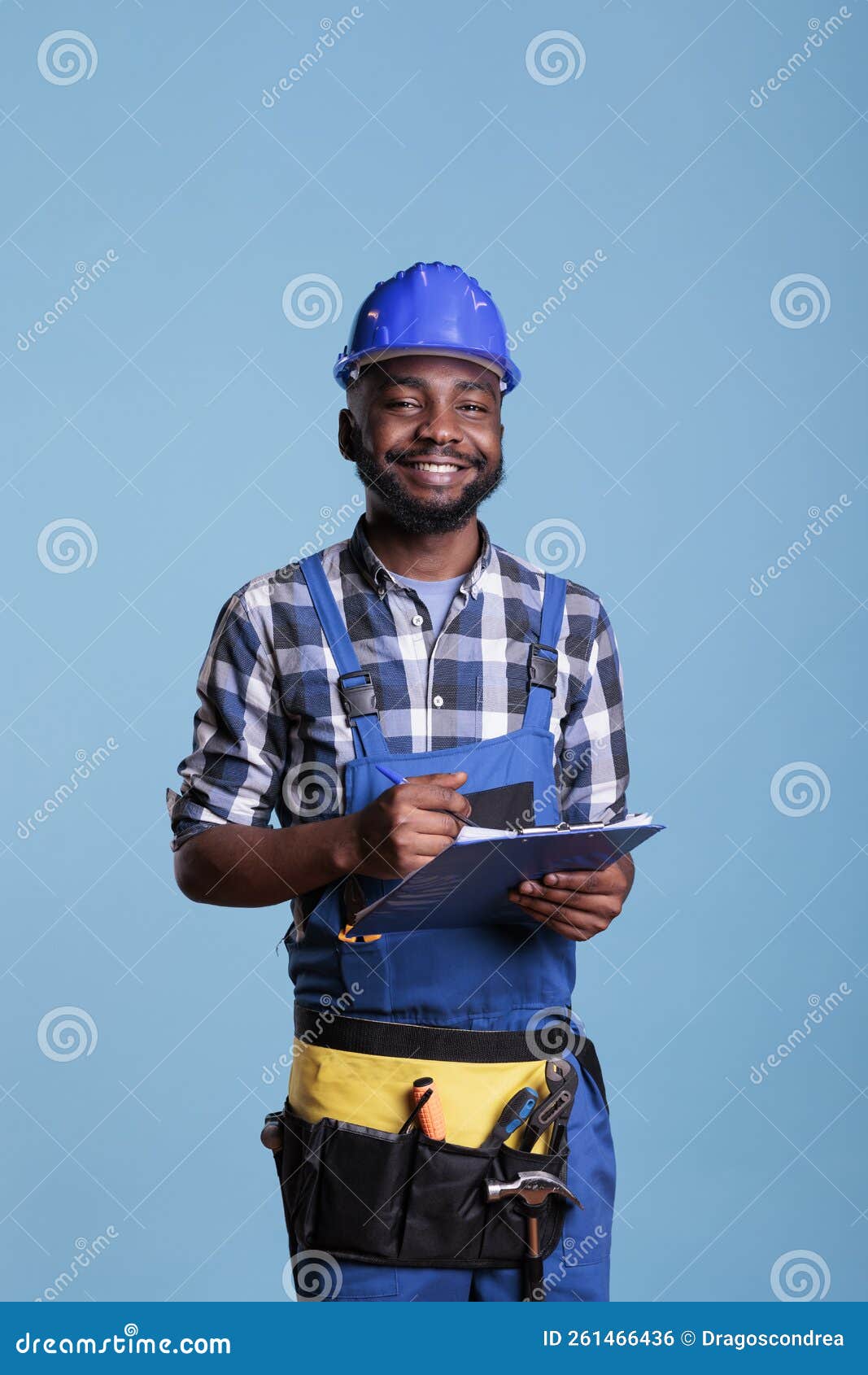 Optimistic Builder Reviewing Construction Paperwork Stock Photo - Image ...
