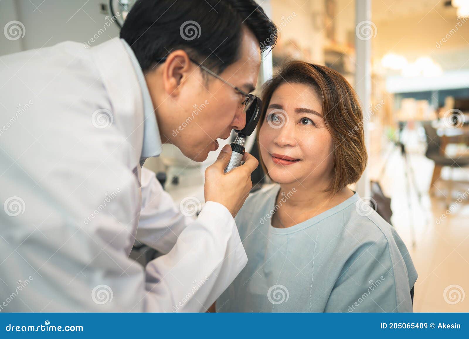 Optometrist Checking Client Eyes Condition in Optical Store Stock Image ...