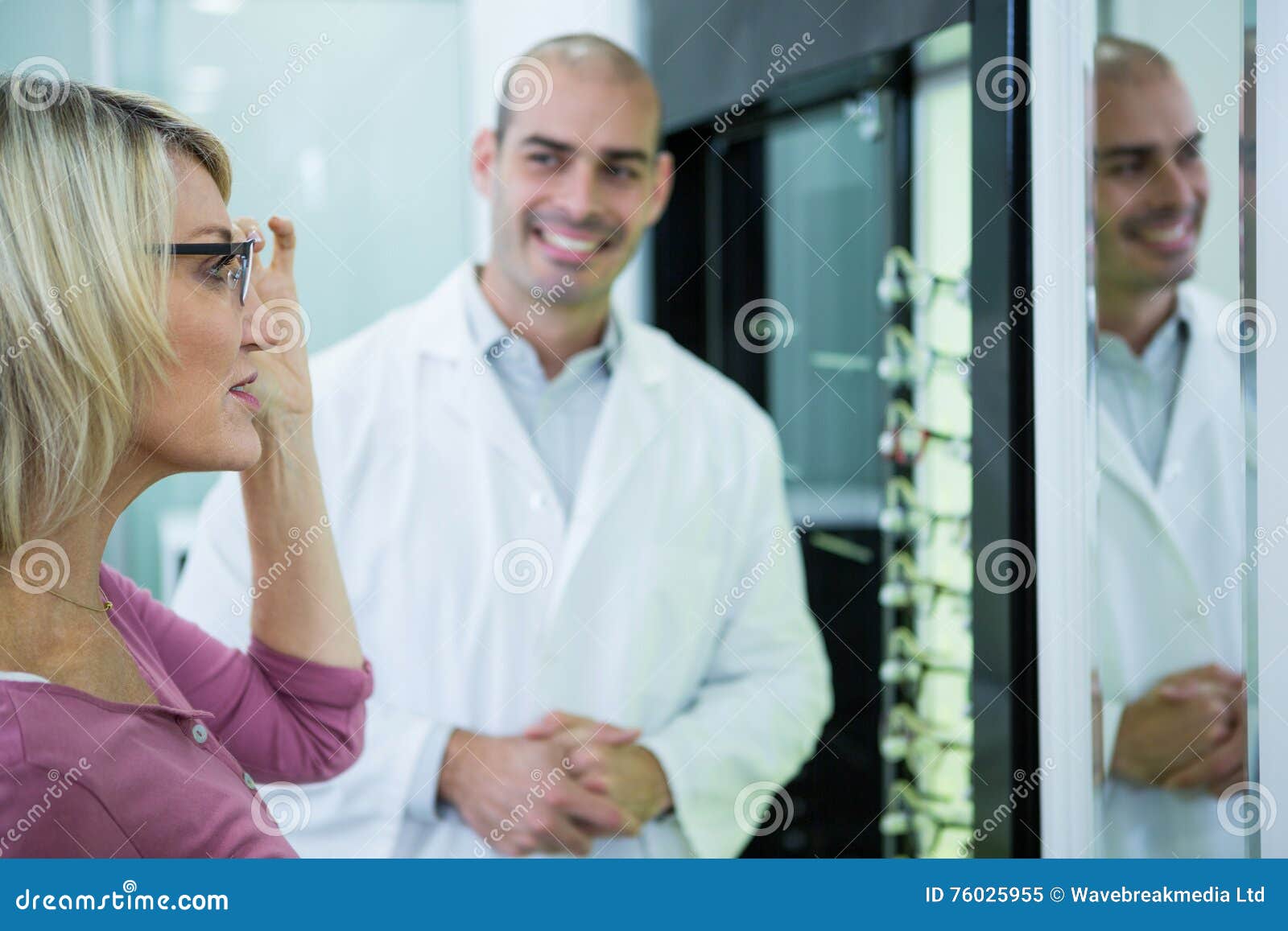 Optometrist Consulting a Customer about Spectacles and Frames Stock ...