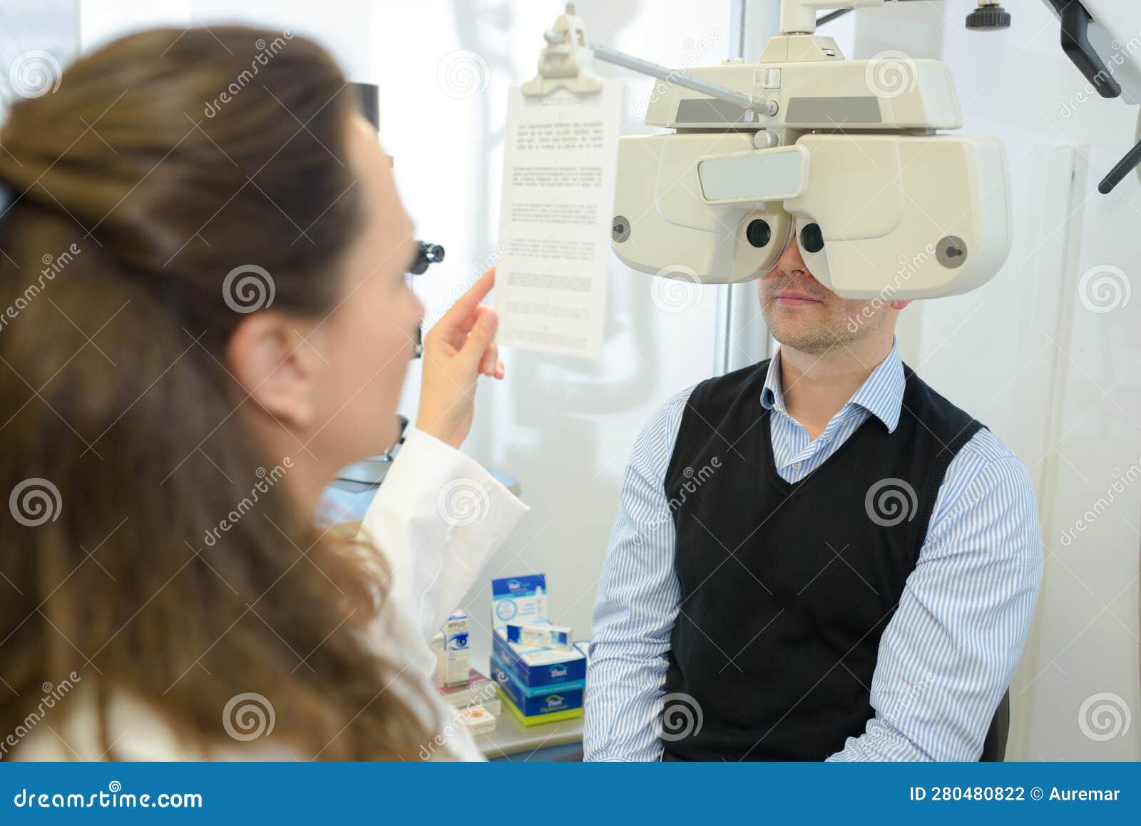 Optometrist Doing Sight Testing for Patient Stock Photo - Image of ...