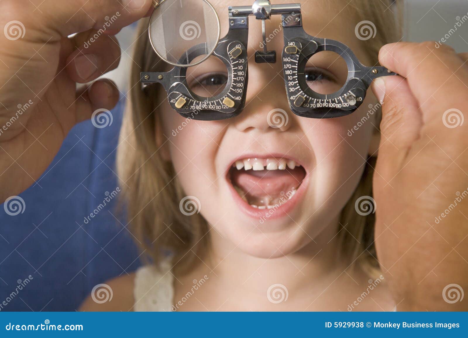 Optometrist in Exam Room with Young Girl Stock Photo - Image of ...
