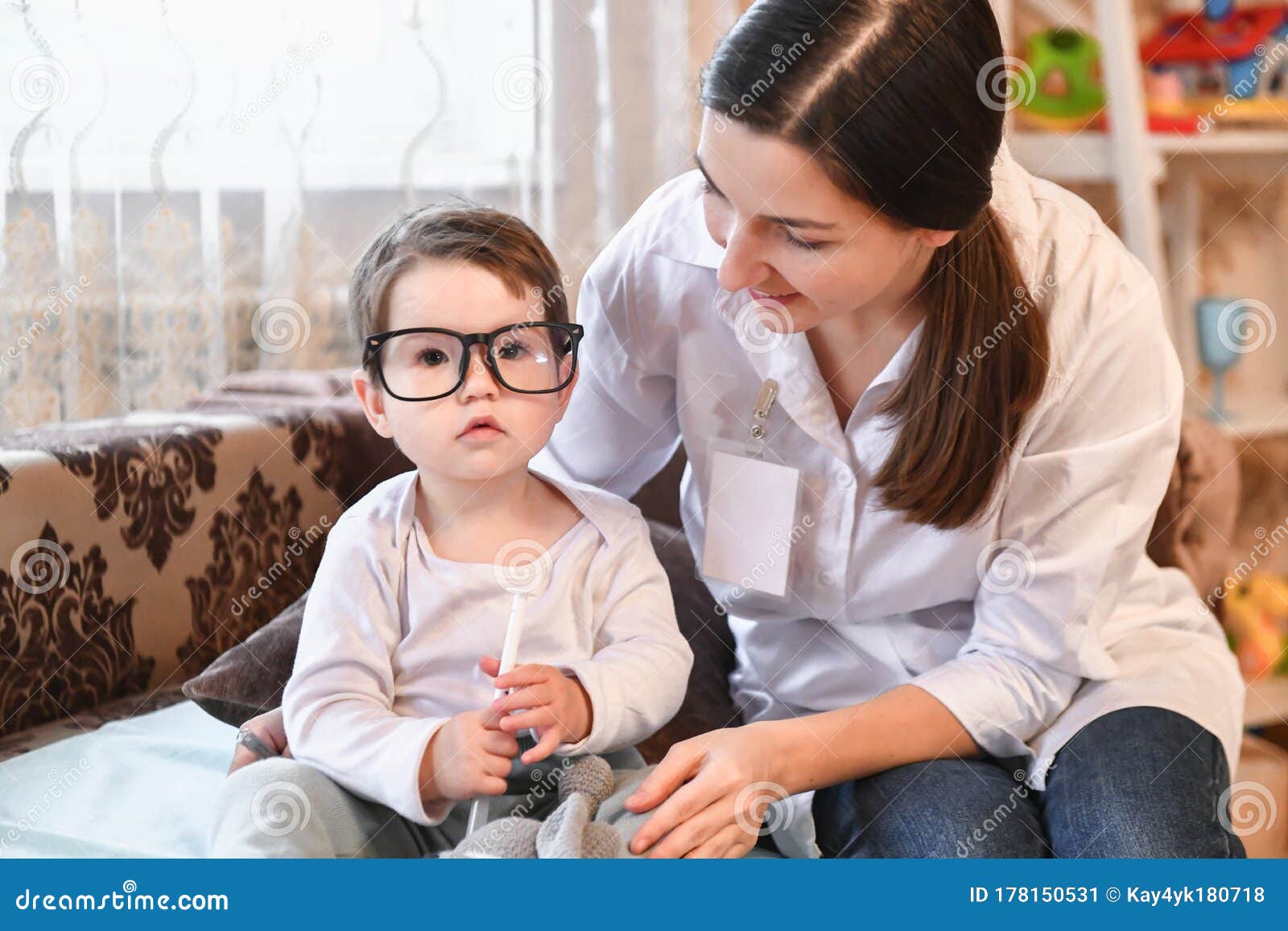An Optometrist Examines a Child at Home. Family Optometrist Stock Image ...