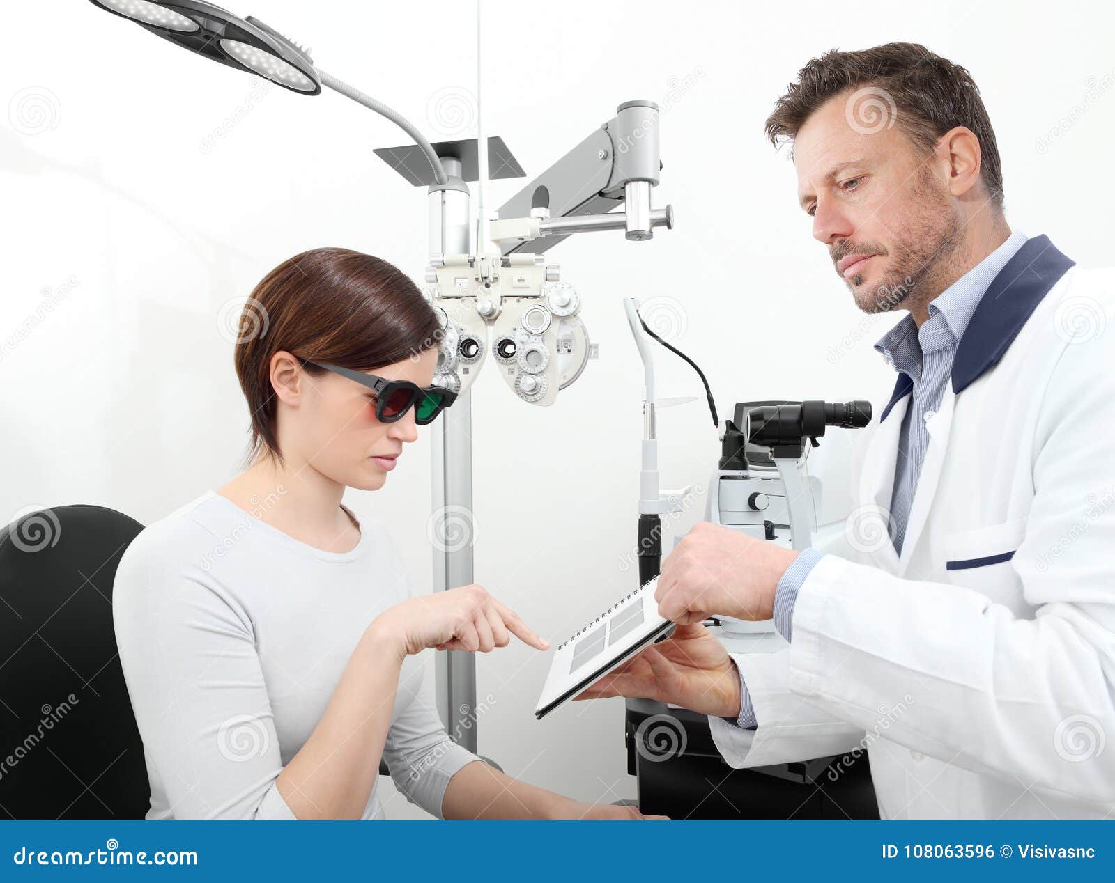 Optometrist Examining Eyesight Woman Patient in Optician Office Stock ... Optometrist Examining Eyesight Woman Patient in Optician Office Stock ...