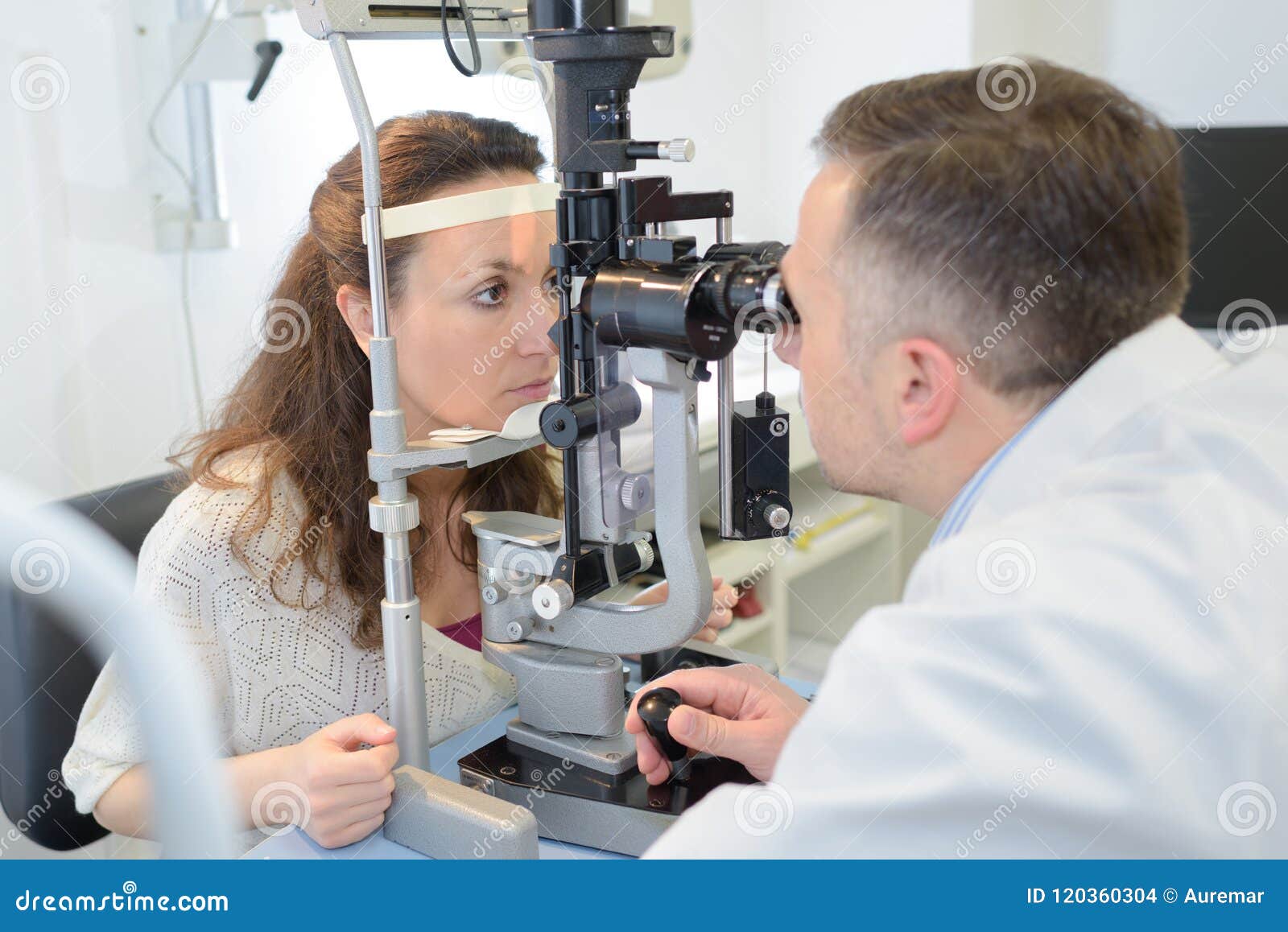 Optometrist Examining Female Patient on Phoropter Stock Photo - Image ... Optometrist Examining Female Patient on Phoropter Stock Photo - Image ...