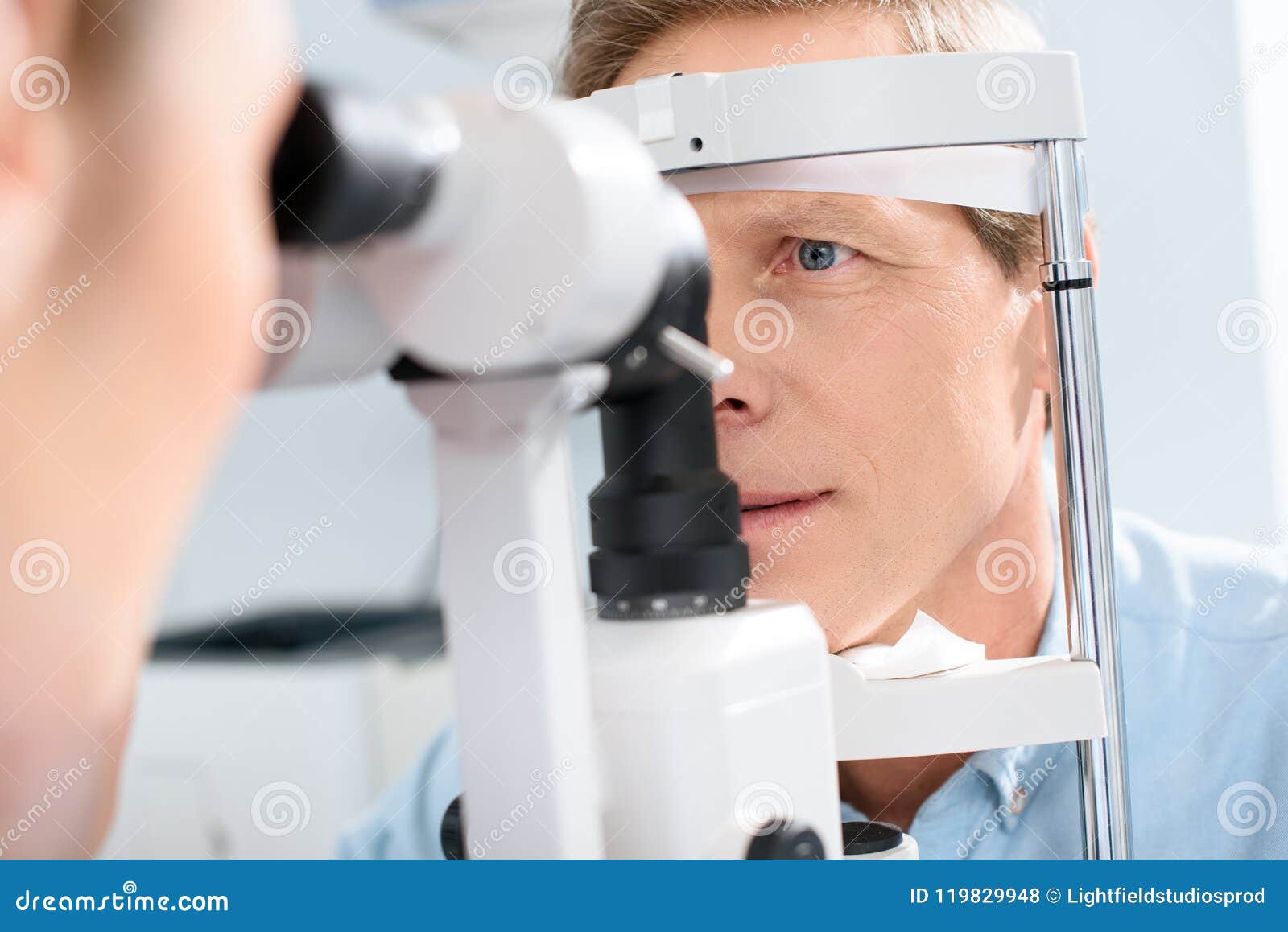Optometrist Examining Man with Modern Stock Photo - Image of medicine ...