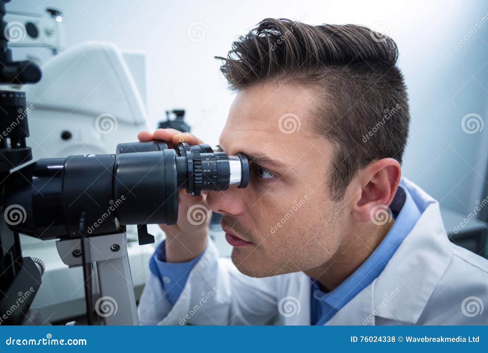 Optometrist Looking through Biomicroscope Stock Photo - Image of ...