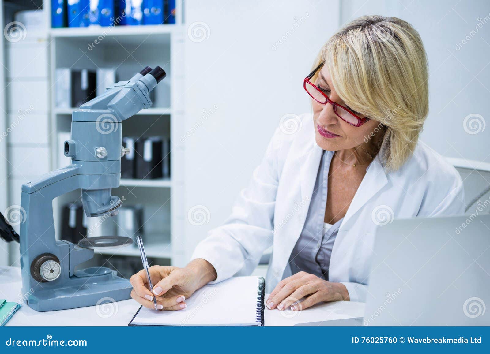 Optometrist Writing in File at Ophthalmology Clinic Stock Photo - Image ...