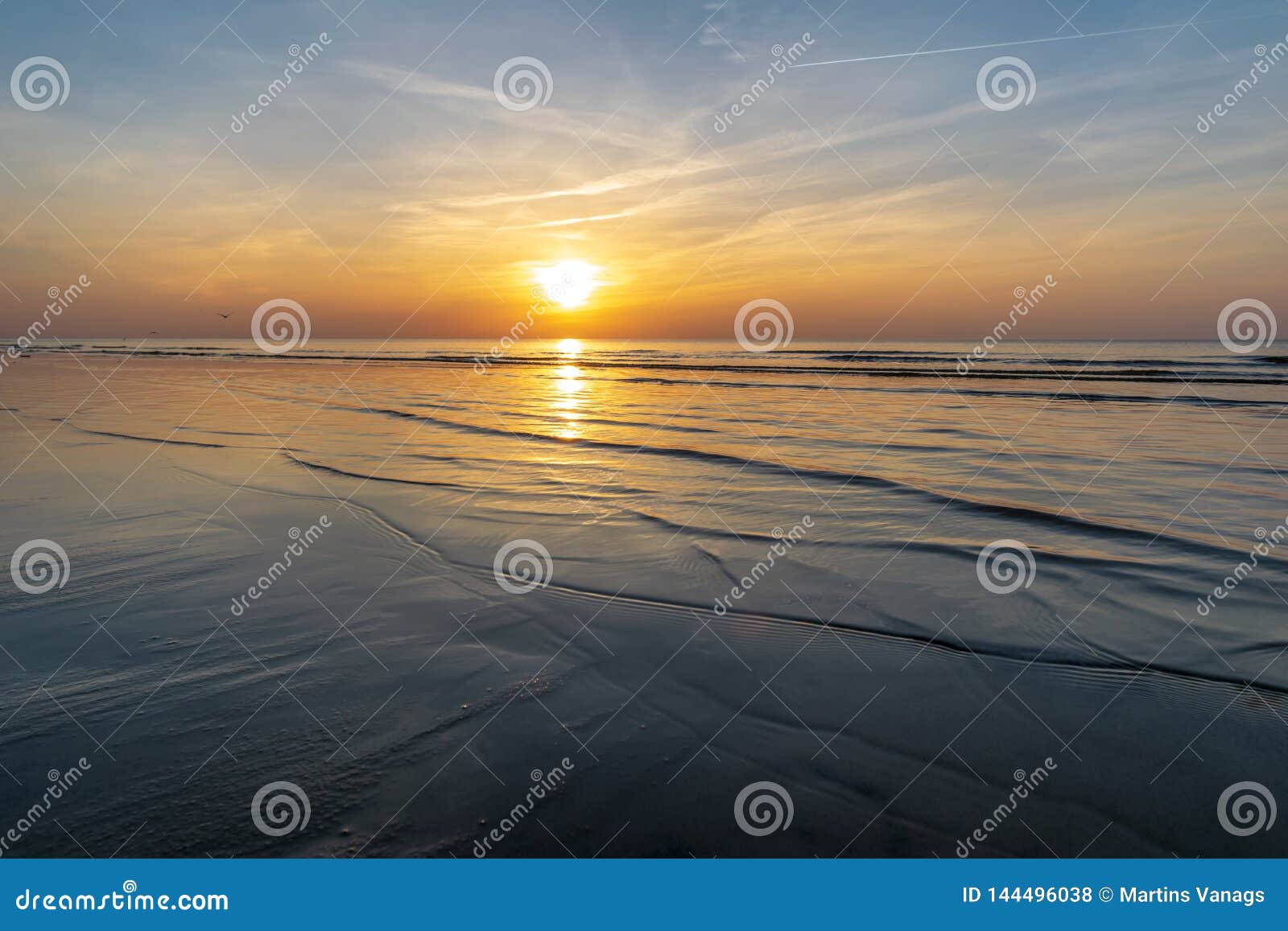 Orabge Colored Sunset Over Calm Sea Beach Water Fields Stock Photo ...
