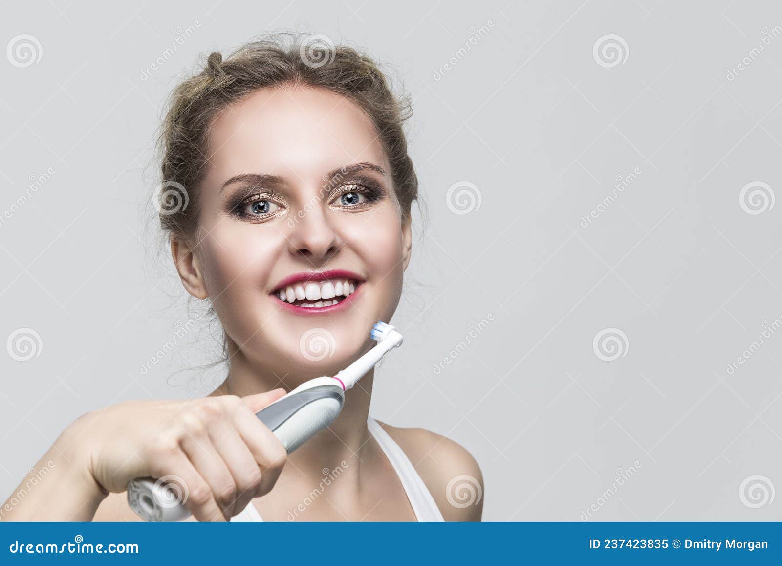 Oralcare And Dentistry Concepts Caucasian Blond Woman Cleaning Teeth