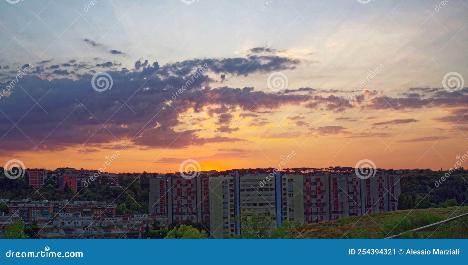 Orange Afternoon Cityscape with Clouds Stock Image - Image of person ...