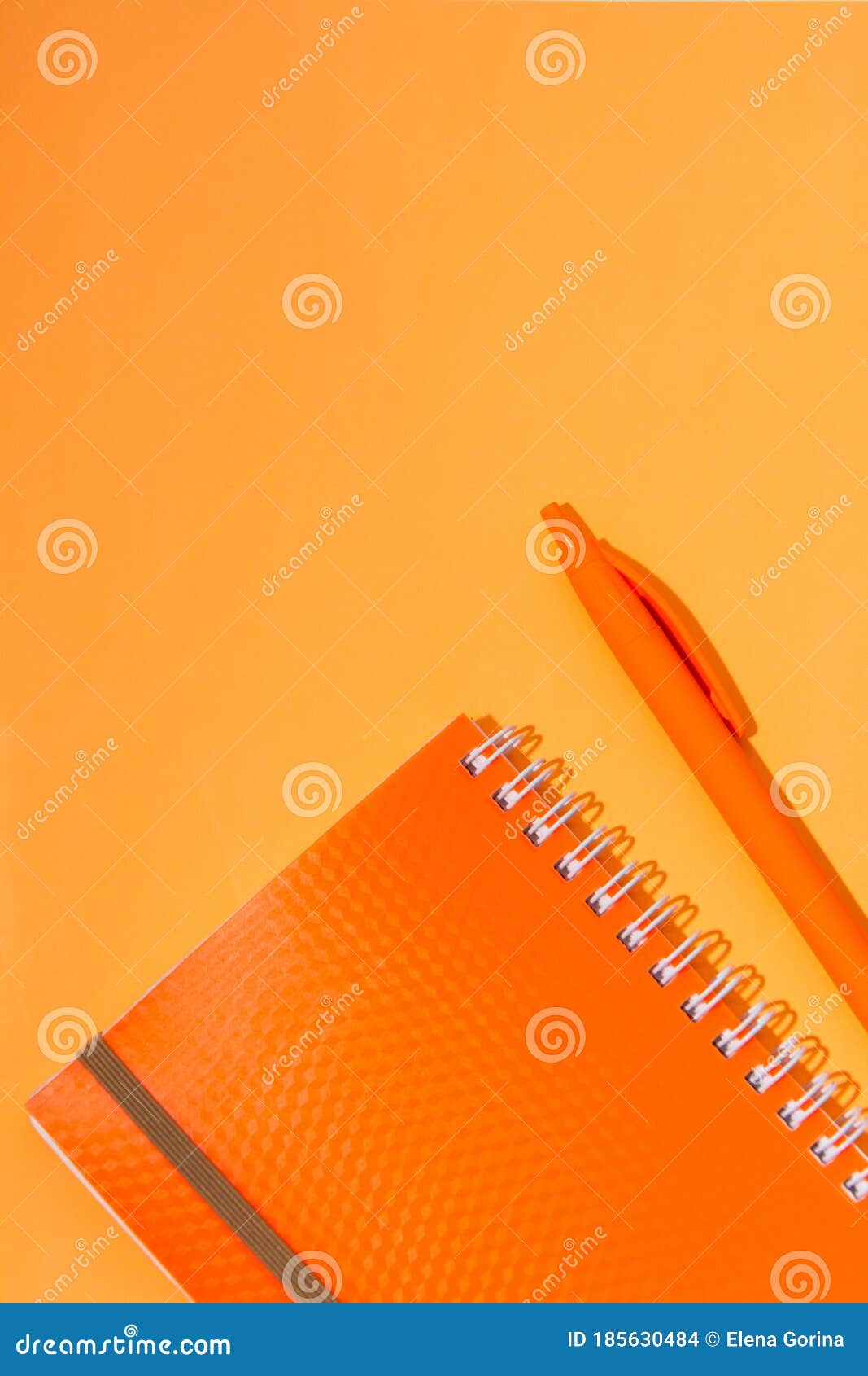 Orange Background with Stationery. Orange Pen and Notebook Stock Photo ...